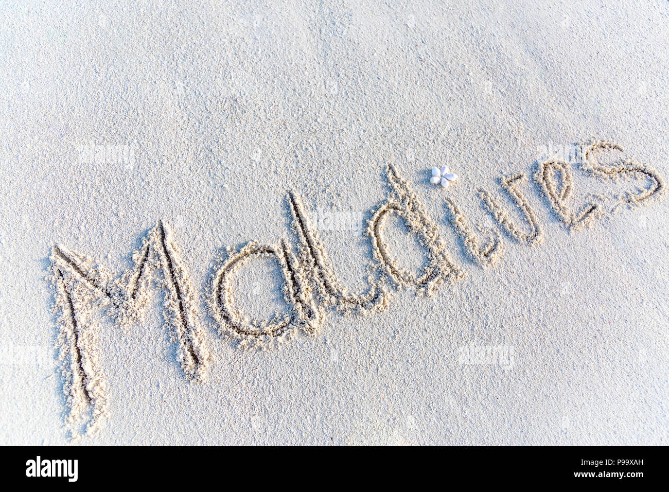 Maldives sign in sand written by hand. +d look sign in sand word ...