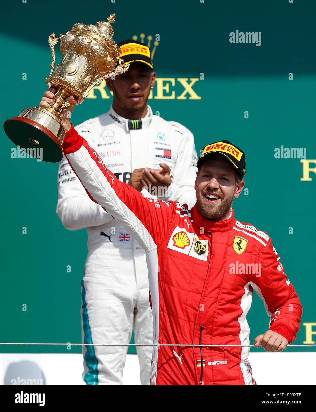 Ferrari's Sebastian Vettel (right) celebrates winning the 2018 British ...