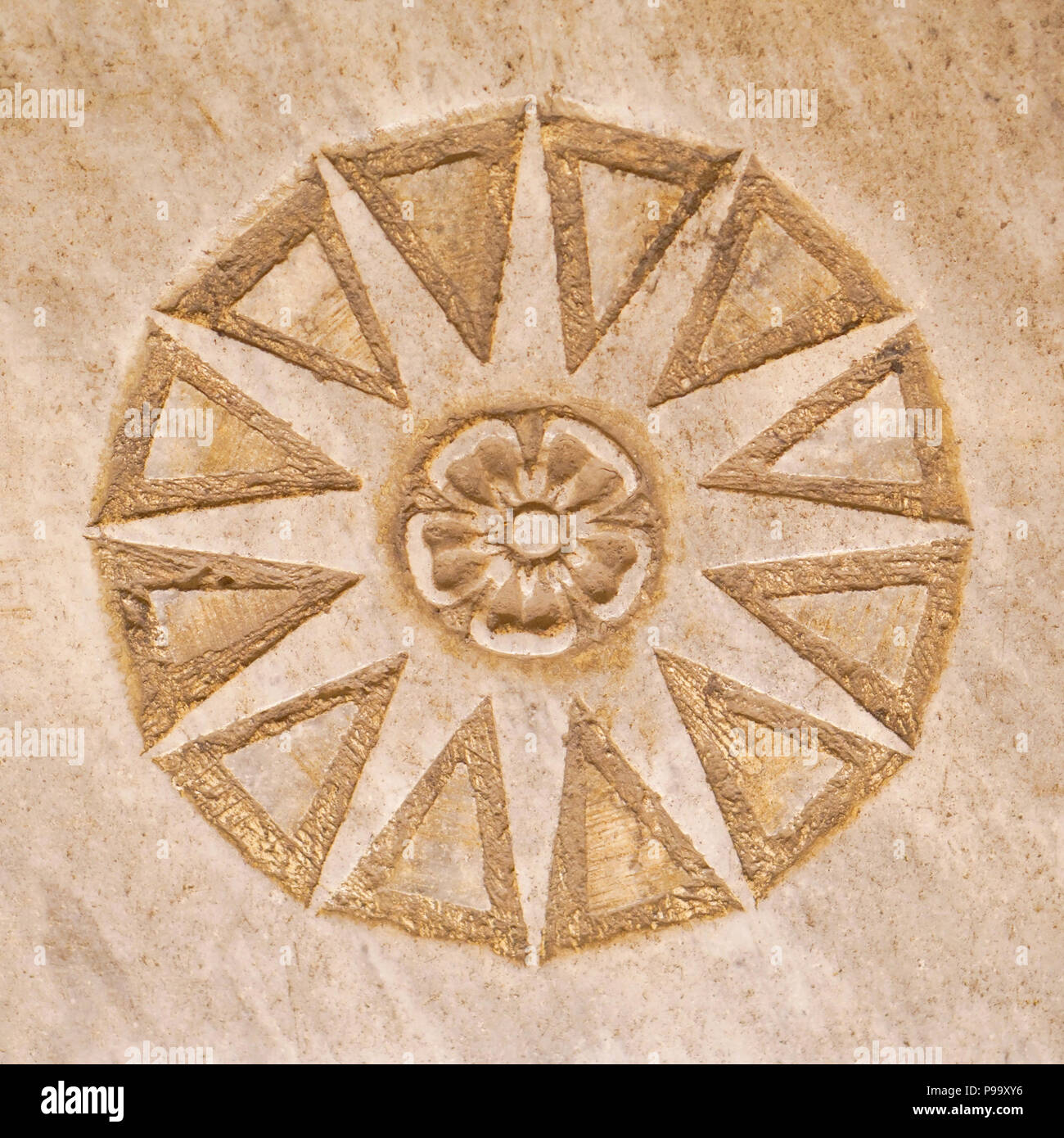 Carved star in marble floor tile Stock Photo - Alamy