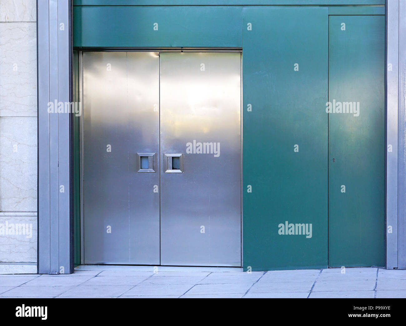 Double metal doors at industril building Stock Photo - Alamy