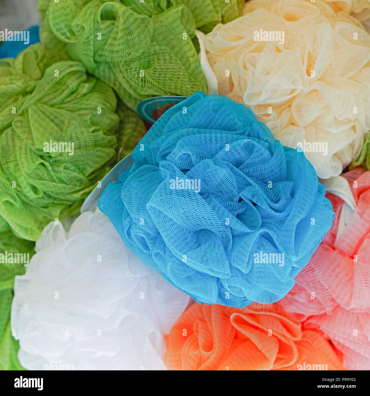 Mesh pouf bath sponge with exfoliating texture Stock Photo - Alamy