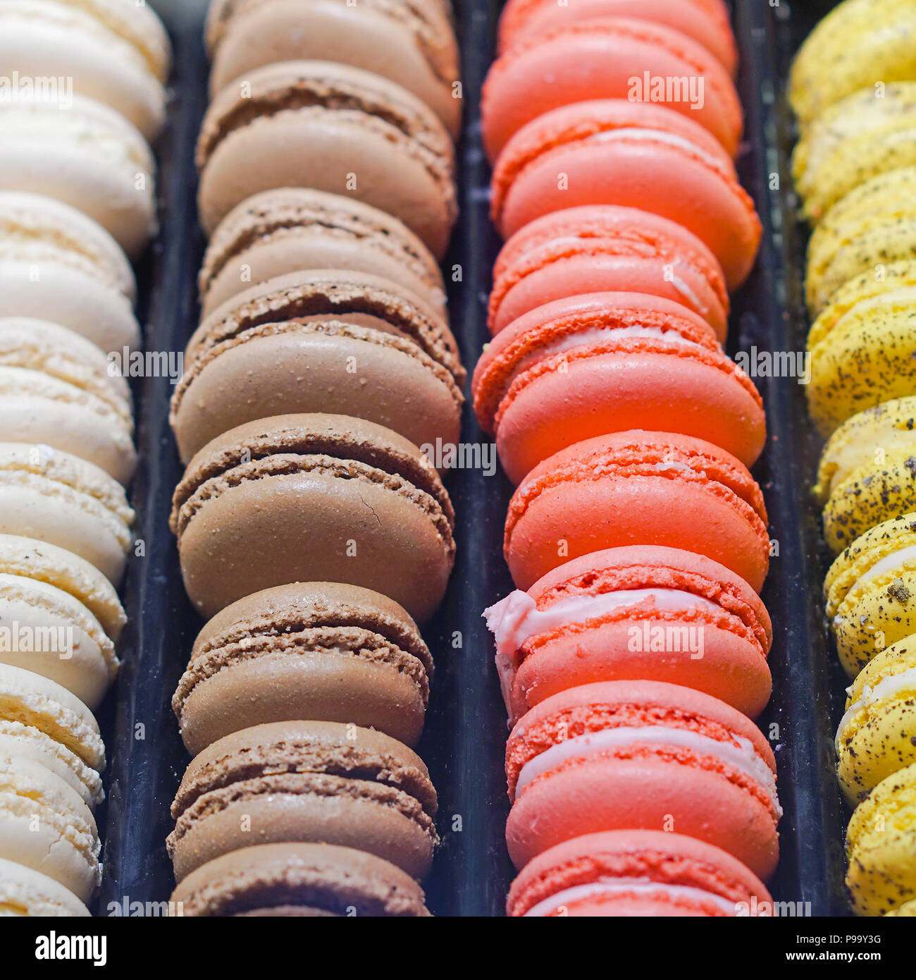 French macarons colorful cookies in row Stock Photo - Alamy