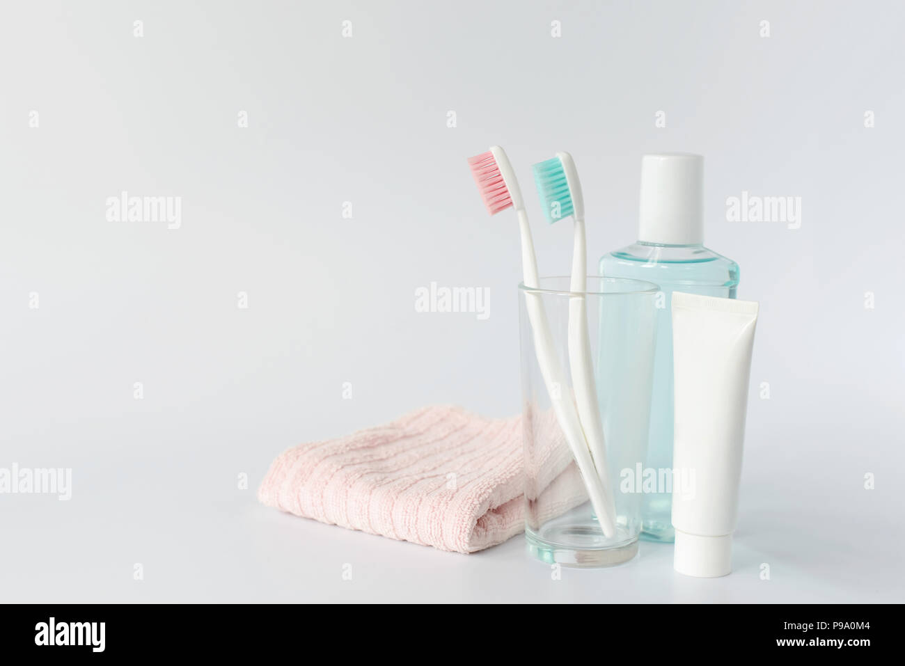 Toothbrushes, toothpaste, rinse and towel on white background. Dental ...