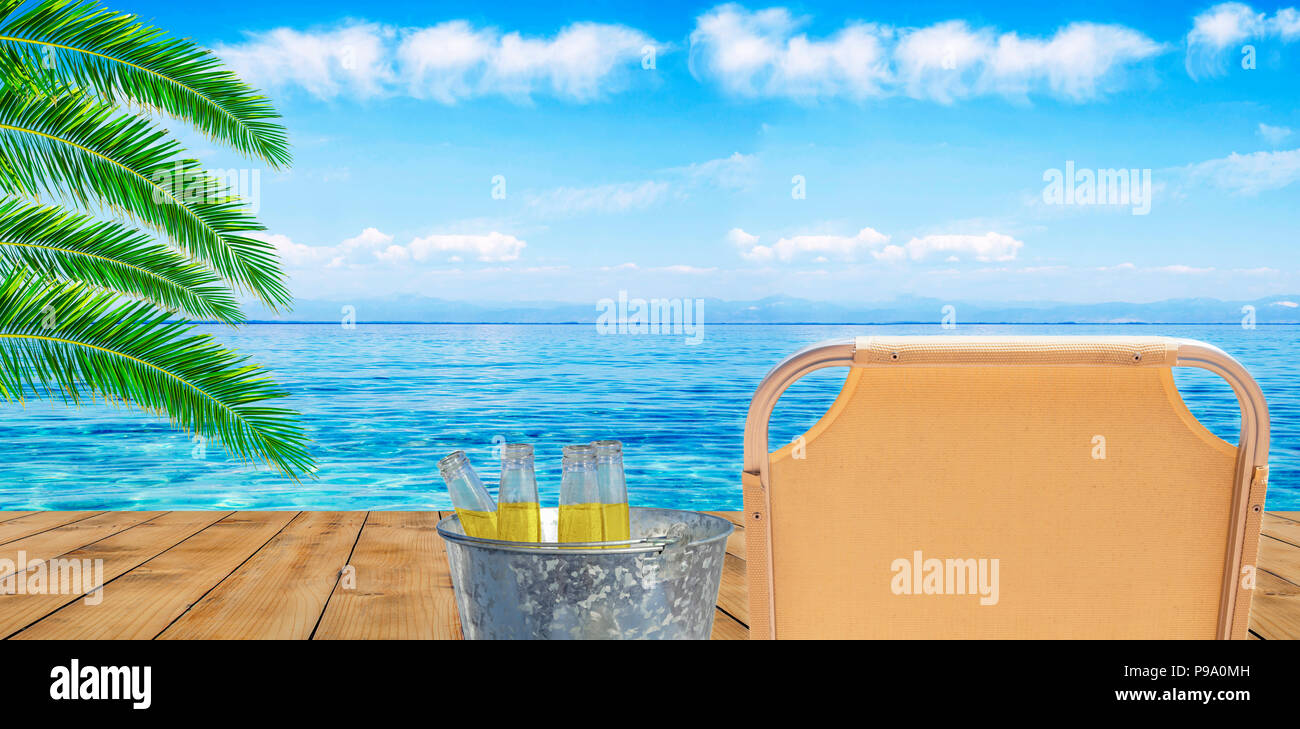 Refreshment drink of four beer bottle in bucket on wooden terrace and ...