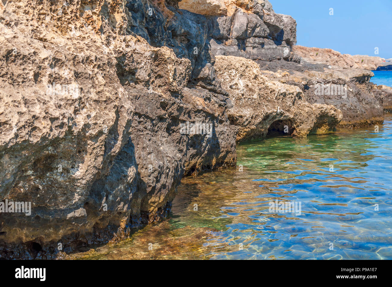 Sea stone natural cliff with water shore beauty seascape background ...