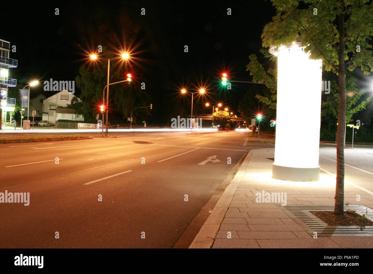 Roads with bright street light and traffic lights at nighttime Stock ...