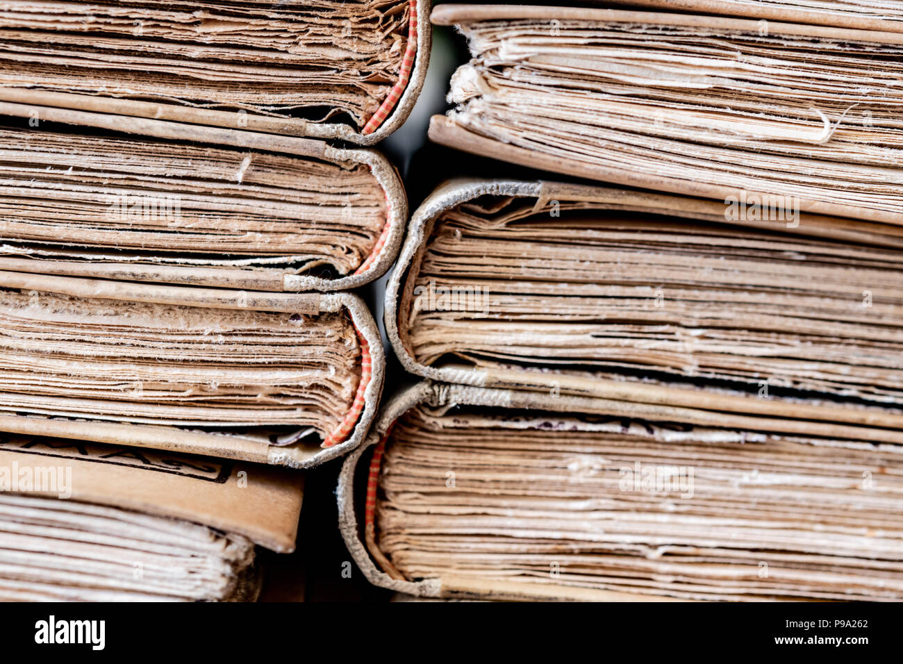 Stack old antique aged books full frame background Stock Photo - Alamy