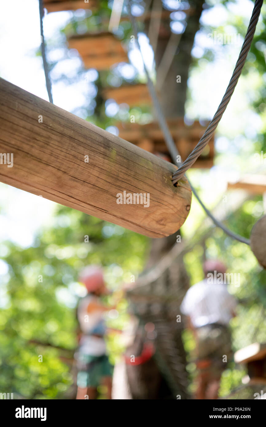 Detail of wooden obstacle path in adventure playground park with out of ...