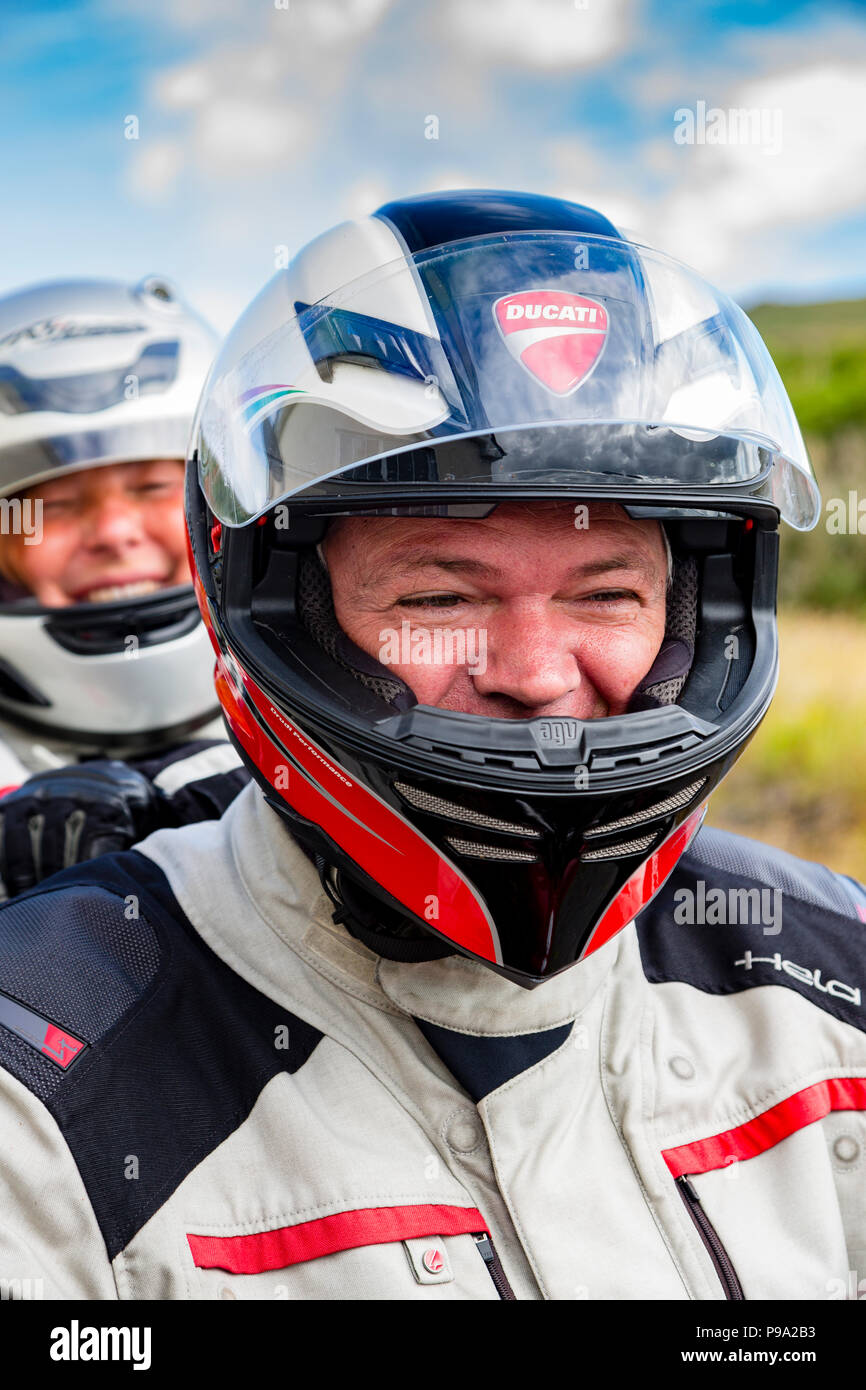 Older couple riding powerful motorbike, Ducati Multistrada 1200 Stock ...