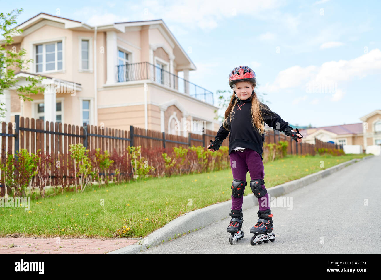Girl Roller Skating in Street Stock Photo - Alamy