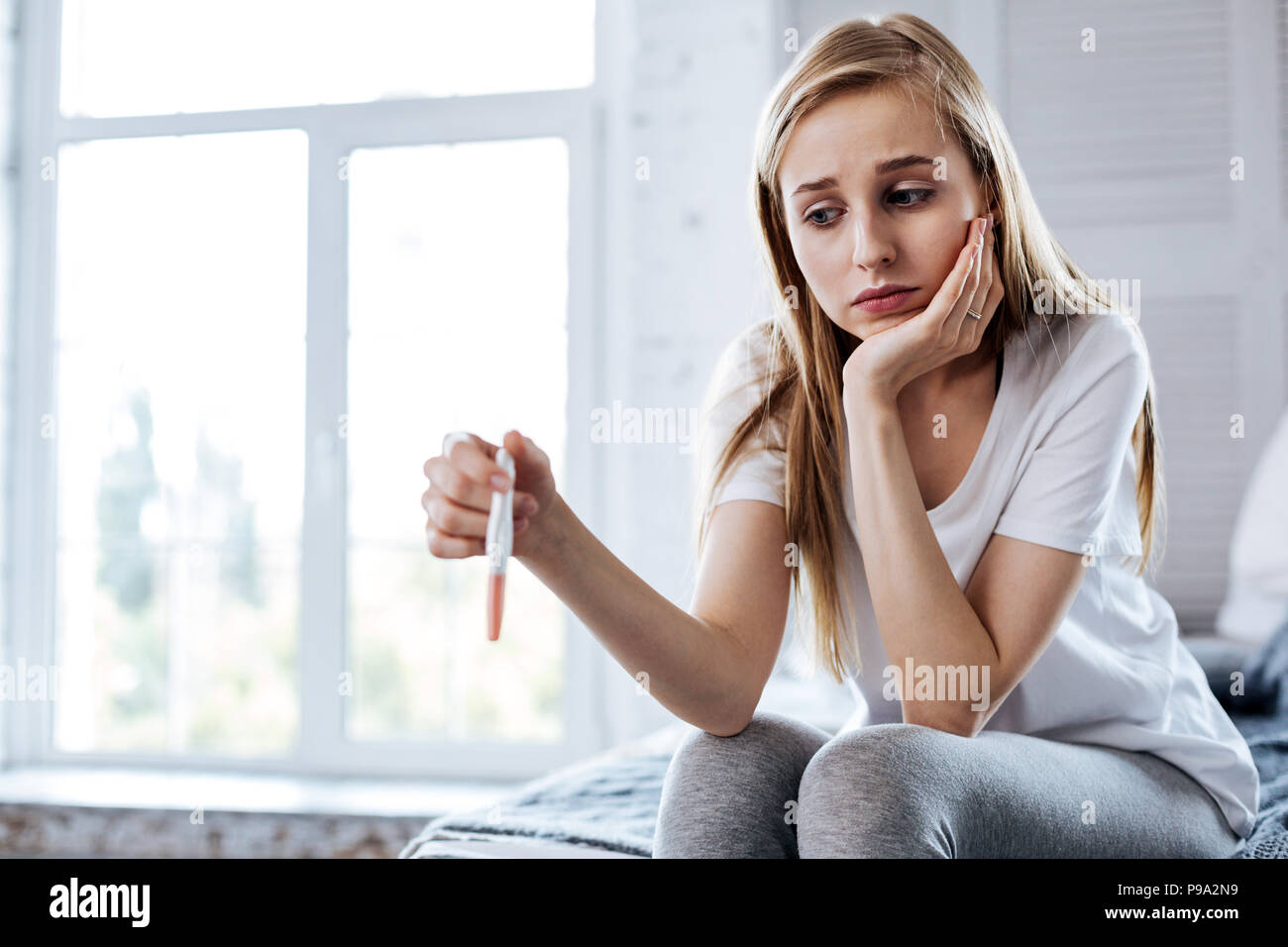 Unsmiling woman hi-res stock photography and images - Alamy