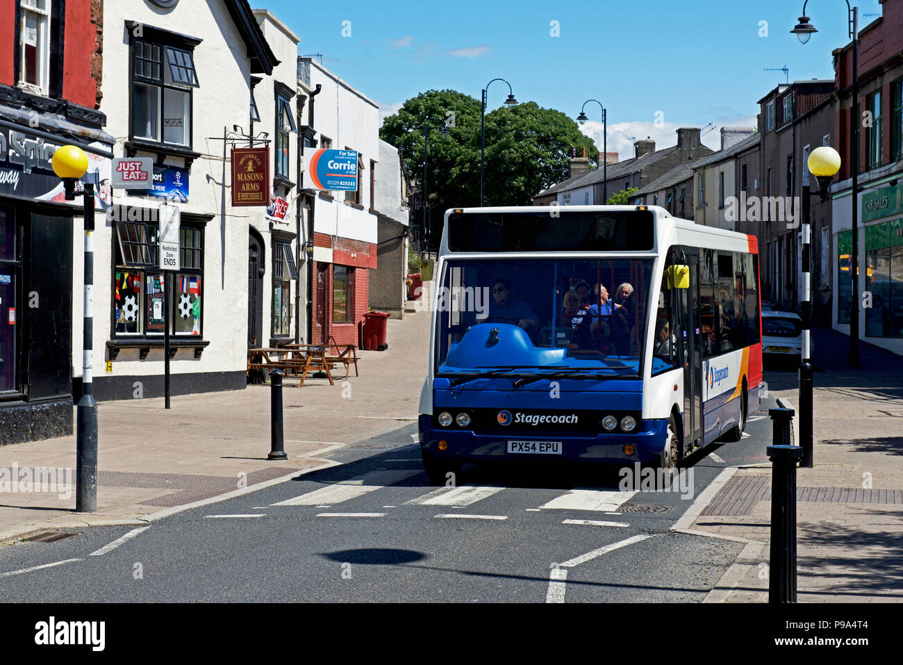 Bus on the high street, Dalton, Cumbria, England UK Stock Photo - Alamy