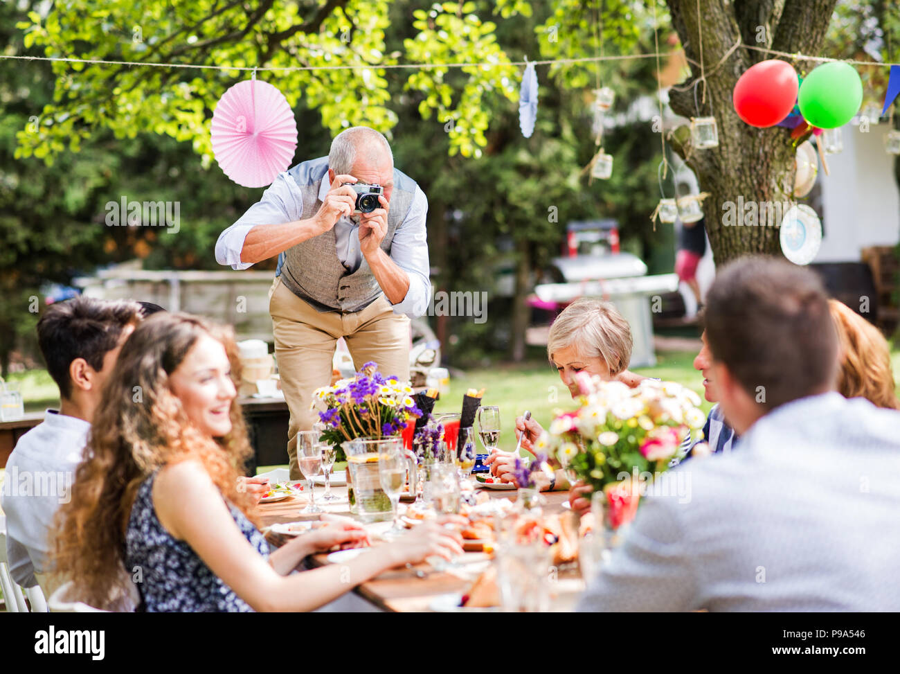 Family celebration or a garden party outside in the backyard Stock ...