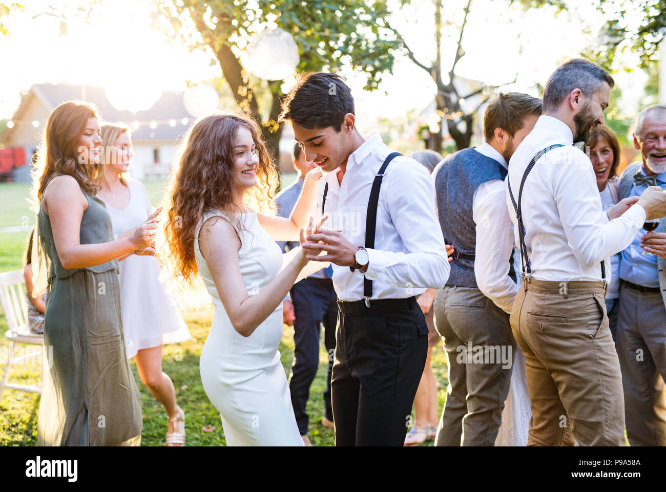 Guests dancing at wedding reception outside in the backyard Stock Photo ...