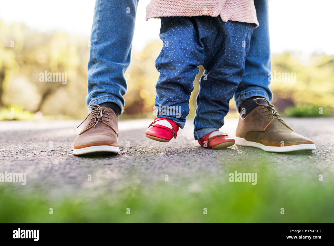 First steps of a toddler girl outside in spring nature Stock Photo - Alamy
