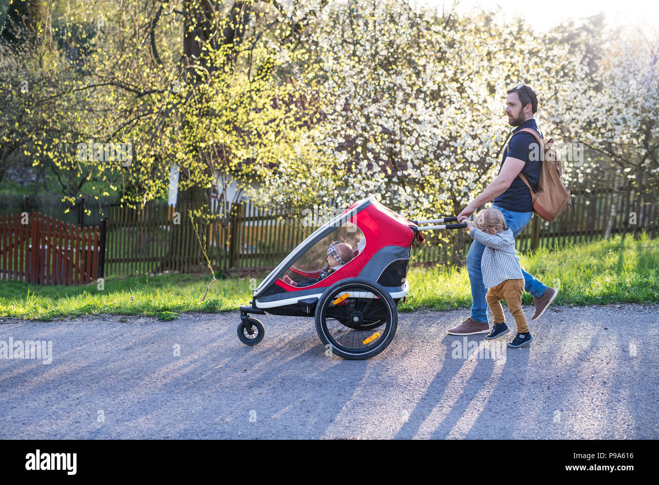 Boy pushing stroller hi-res stock photography and images - Alamy