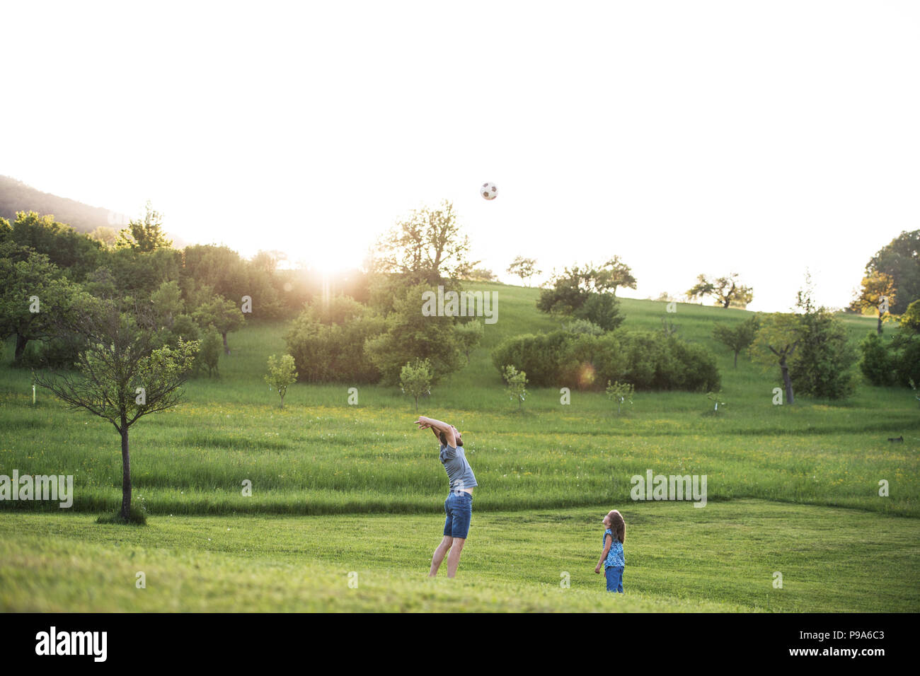 Dad and daughter playing football hi-res stock photography and images ...