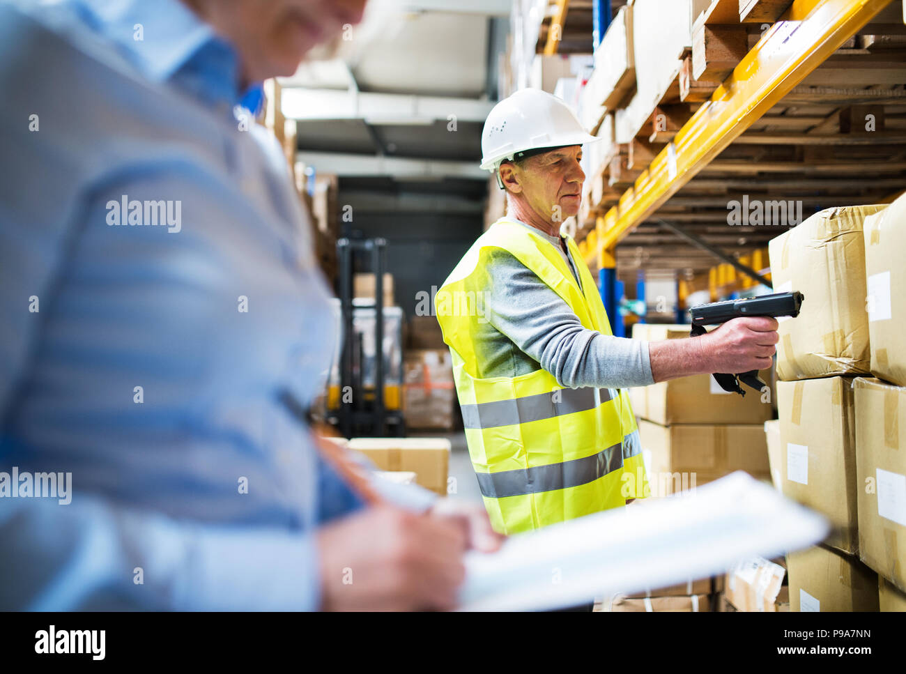 Woman in safety vest hi-res stock photography and images - Alamy