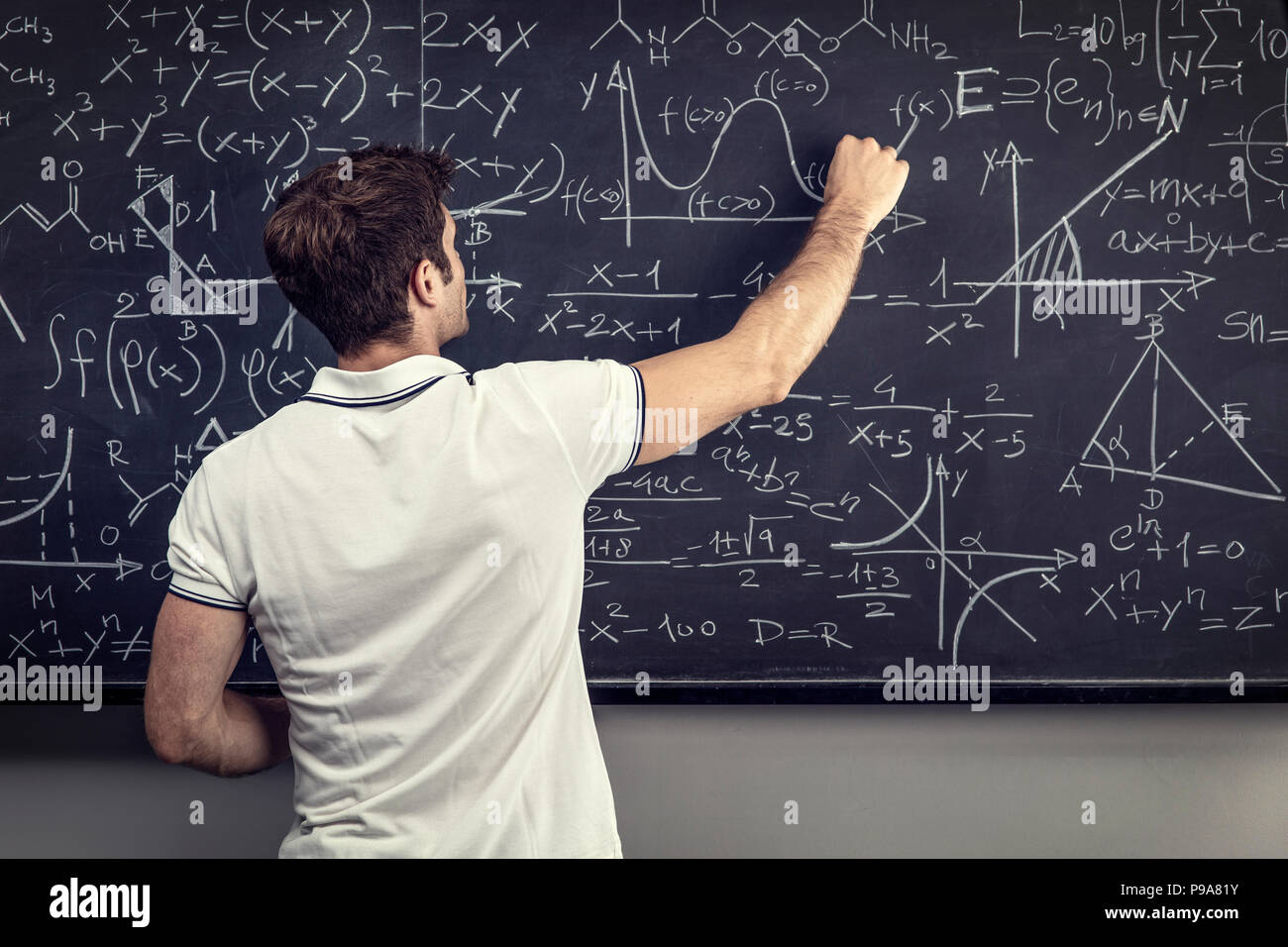 teacher write on classic vintage chalkboard Stock Photo - Alamy