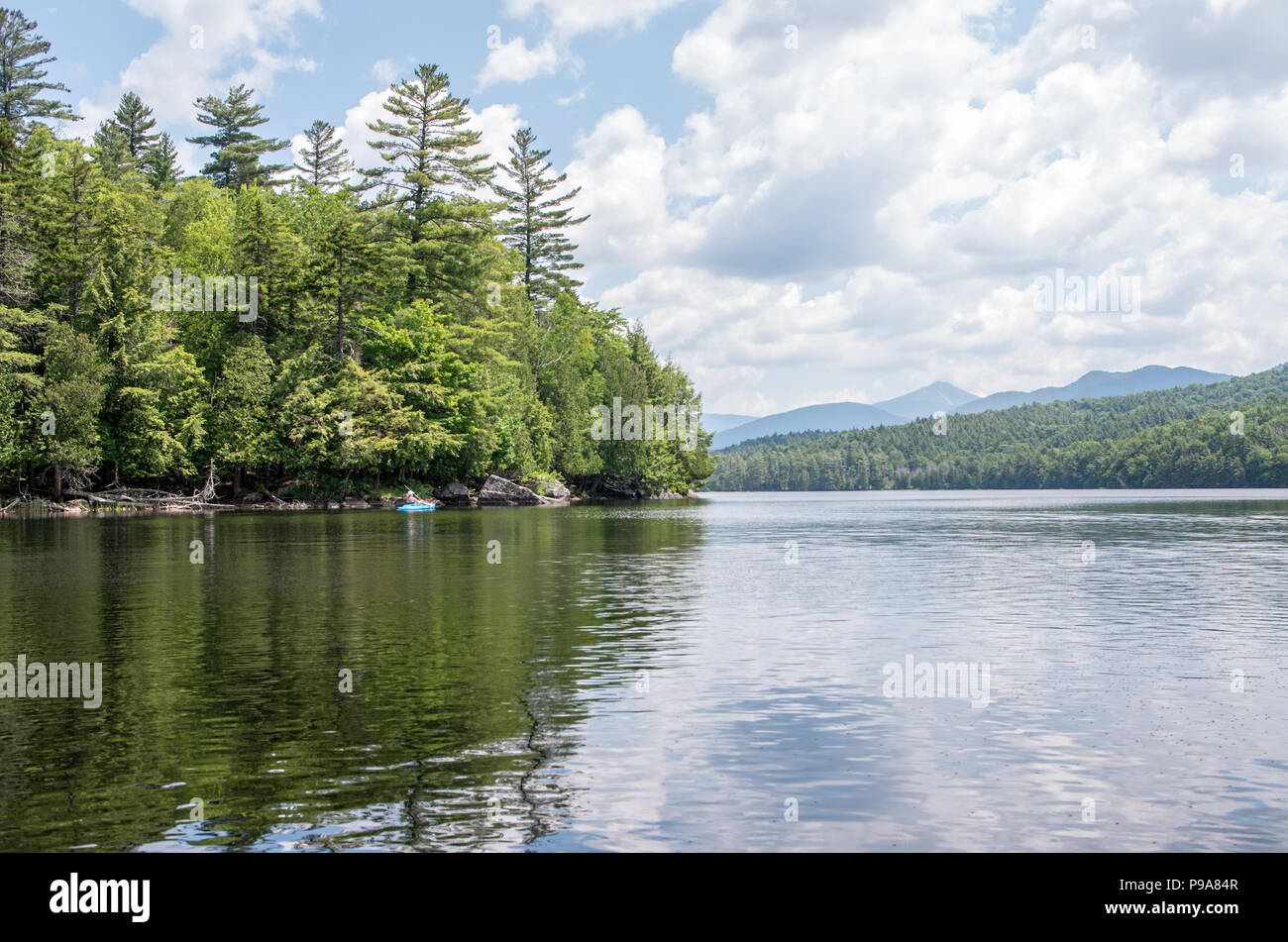 Female kayaker on a remote pond in the Adirondack wilderness Stock ...