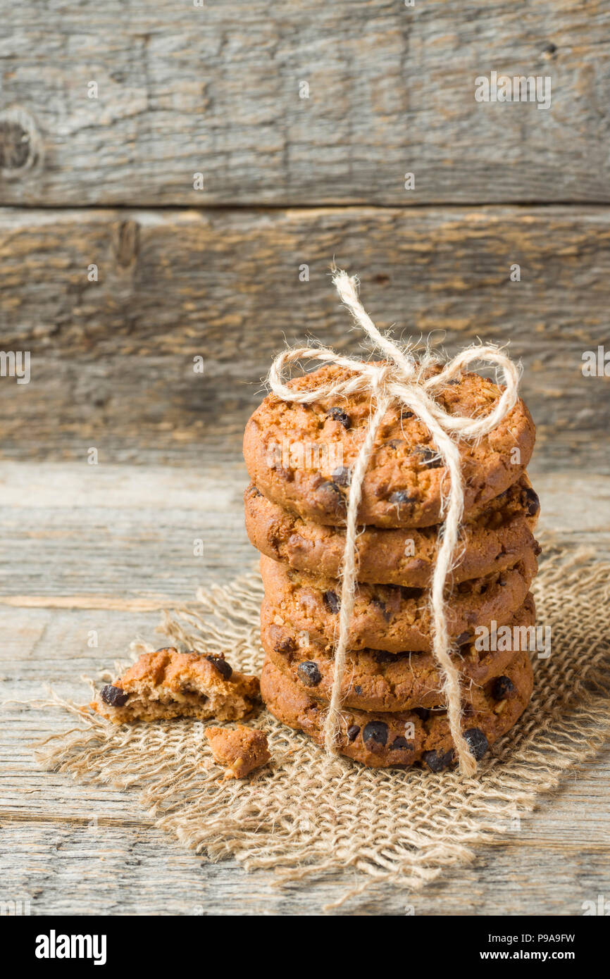 Homemade cookies with chocolate thread tied on a wooden table Stock ...