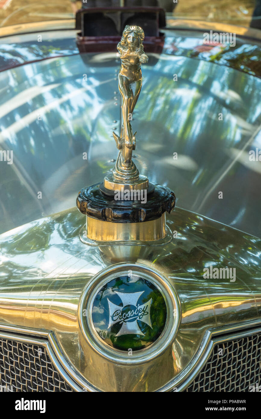 Crossley Lady on a winged wheel mascot and radiator badge Stock Photo ...