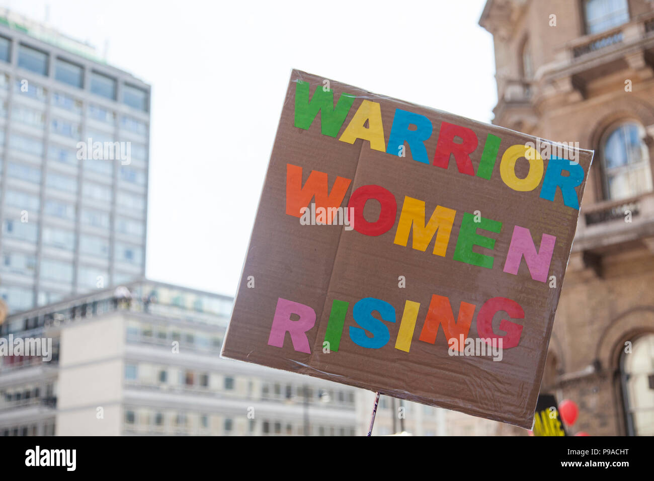 Warrior women rising political banner at a protest march Stock Photo ...