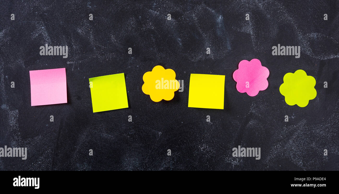 School concept. Six colorful notes in various shapes with copy space on ...