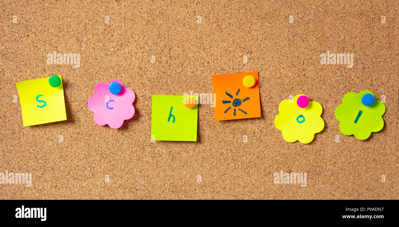 School concept. Colorful sticky notes, with letters writing school, in ...