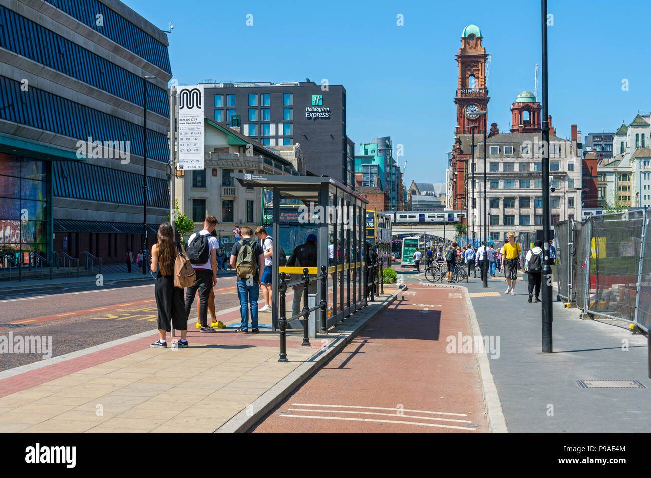 A bus stop with a 'Dutch style' cycle lane behind it, Oxford Road, Manchester, England, UK Stock ...
