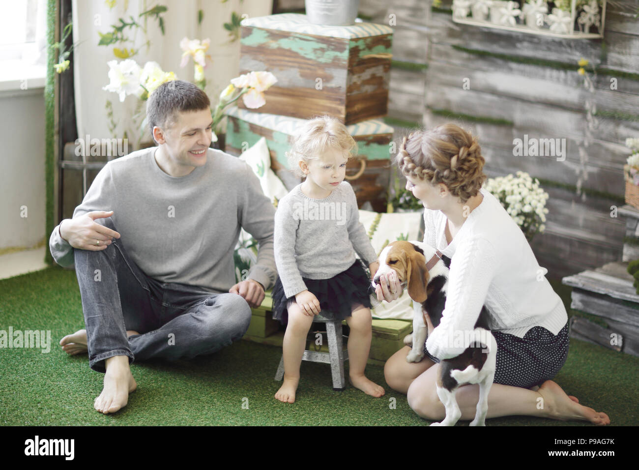 mom and dad are talking to their daughter Stock Photo - Alamy