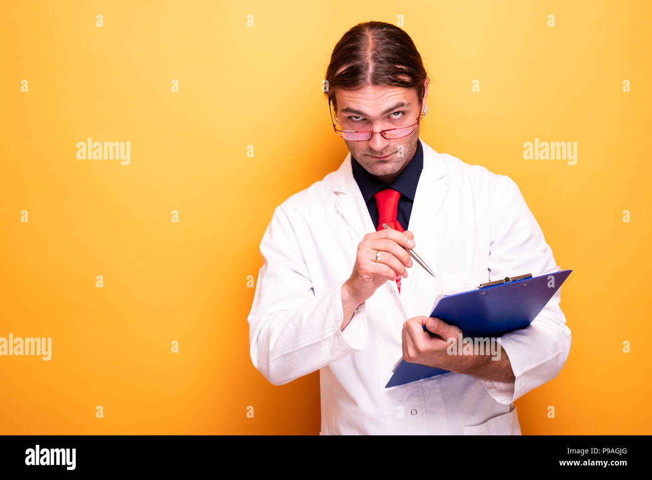 Portrait of male doctor awaiting confirmation Stock Photo - Alamy