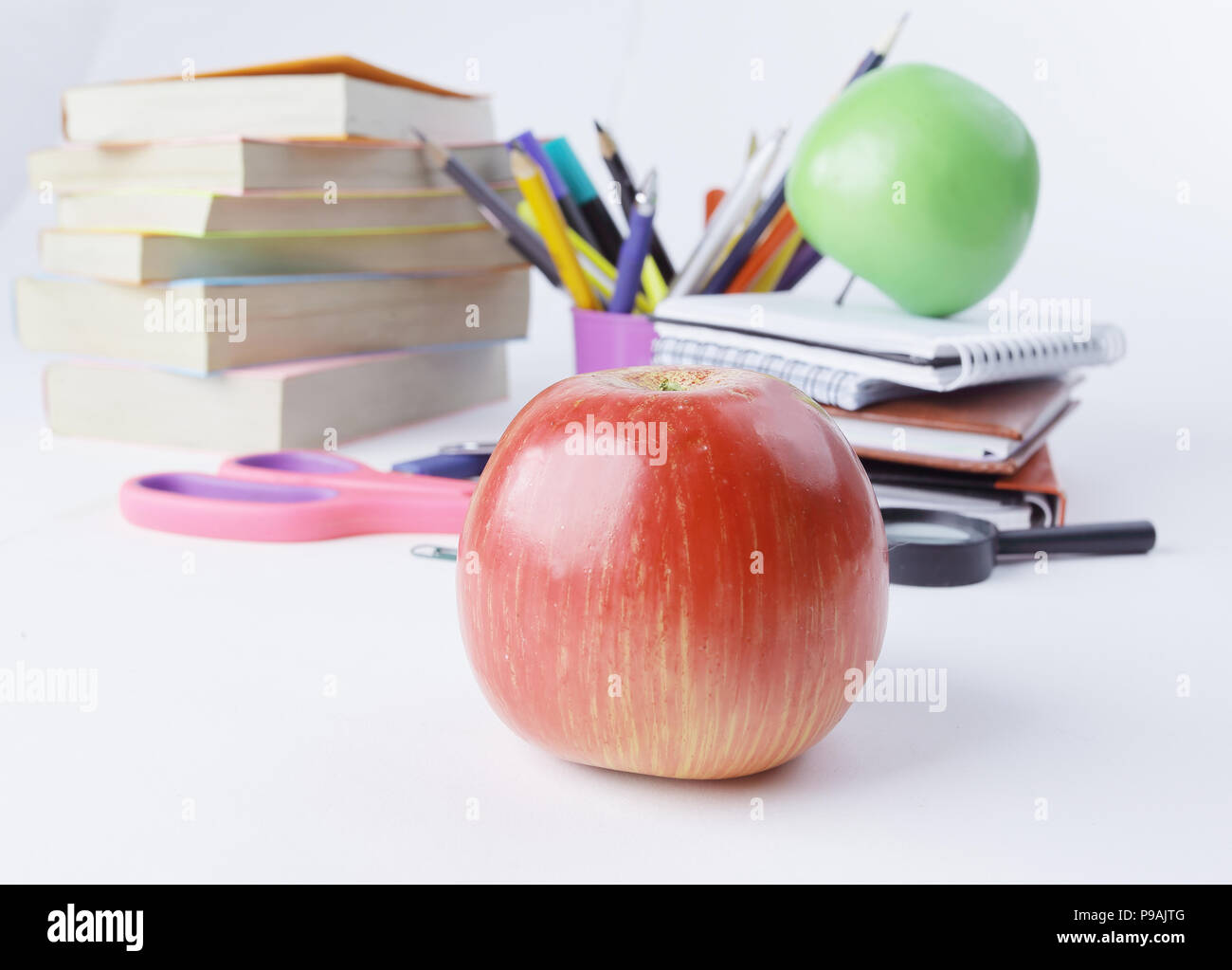 red Apple on the background of school supplies .concept of education ...
