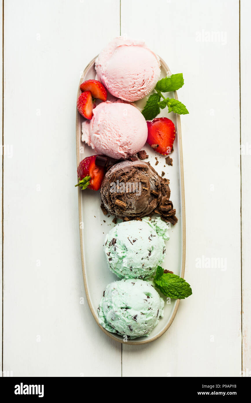 Selection of different ice cream scoops such as mint, chocolate and ...