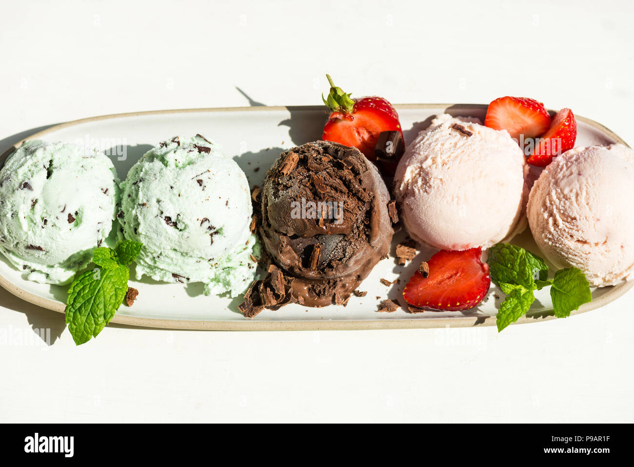 Selection of different ice cream scoops such as mint, chocolate and ...
