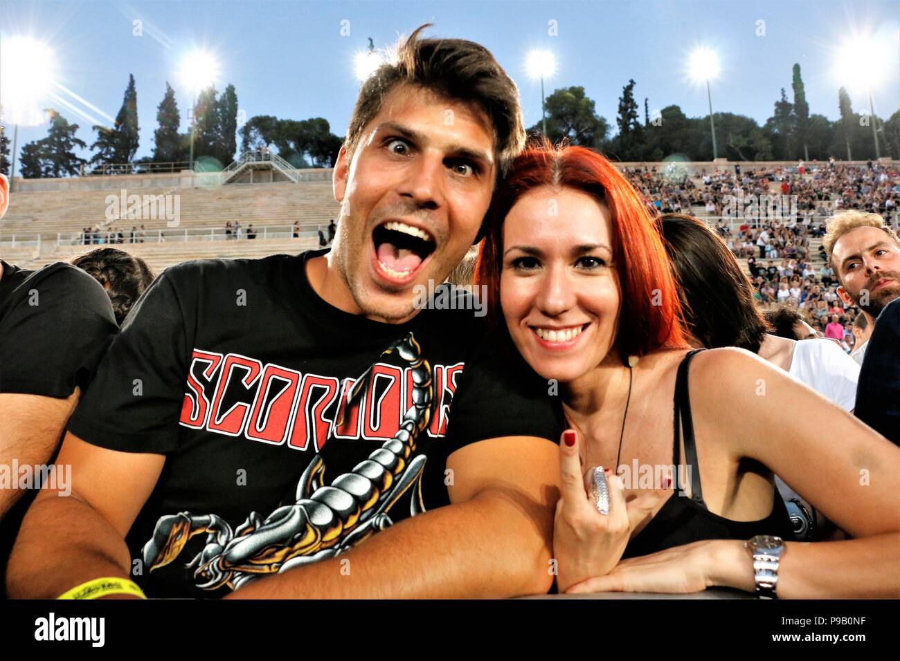 Athens, Greece. 16th July, 2018. Fans of Scorpions pose wearing a t ...