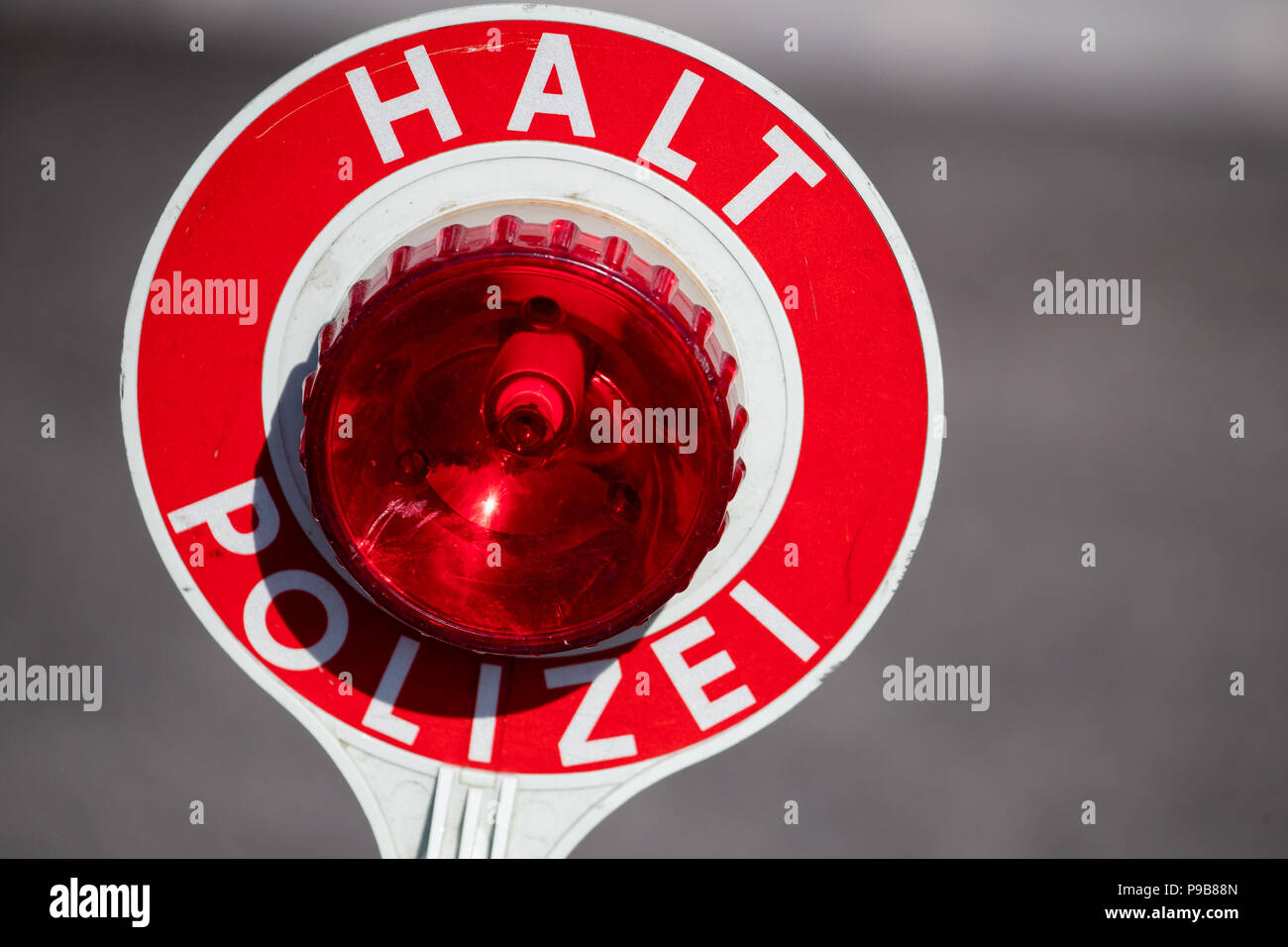 Nuremberg, Germany. 17th July, 2018. A police signalling disc reads ...