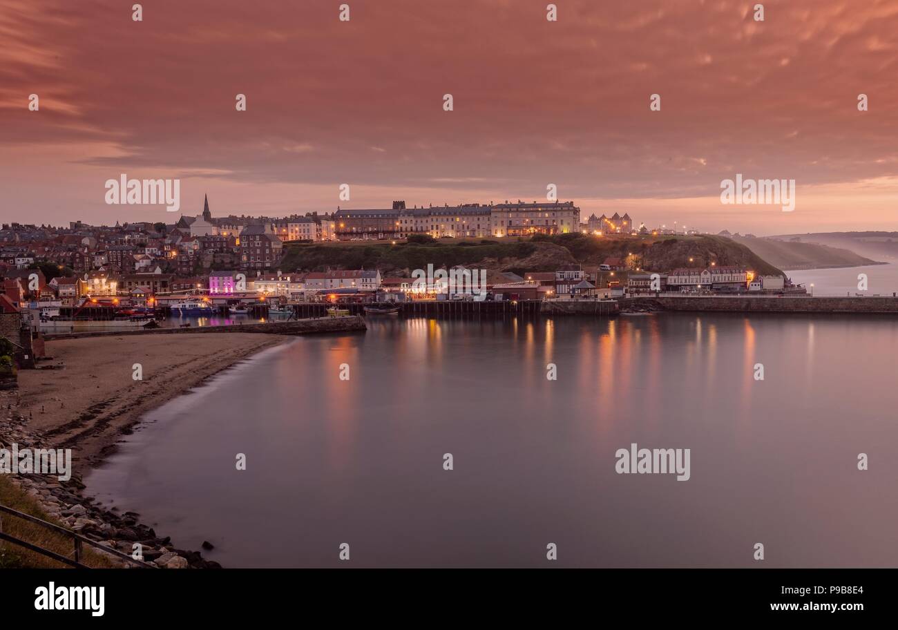A view of Whitby town at night from across the outer harbour. The ...