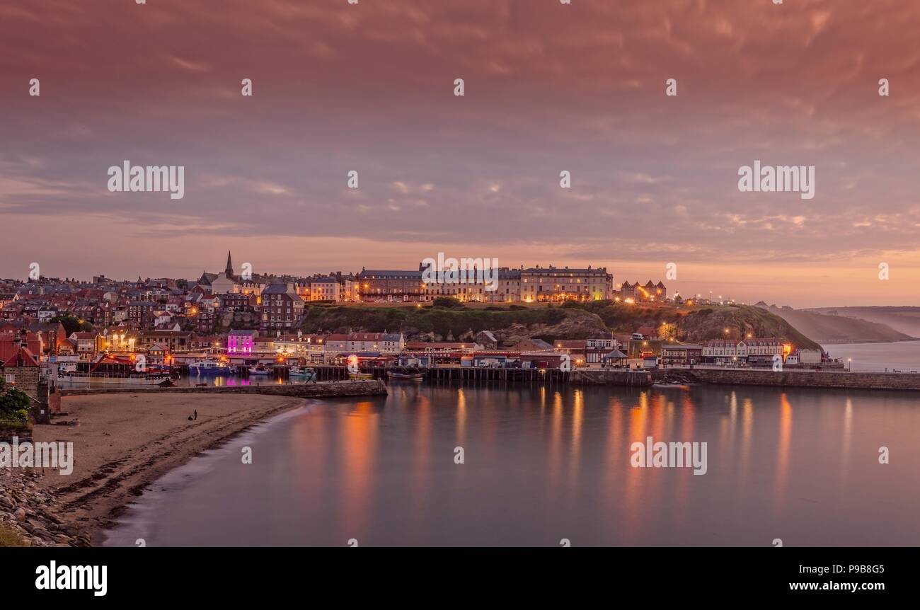 A view of Whitby town at night from across the outer harbour. The ...