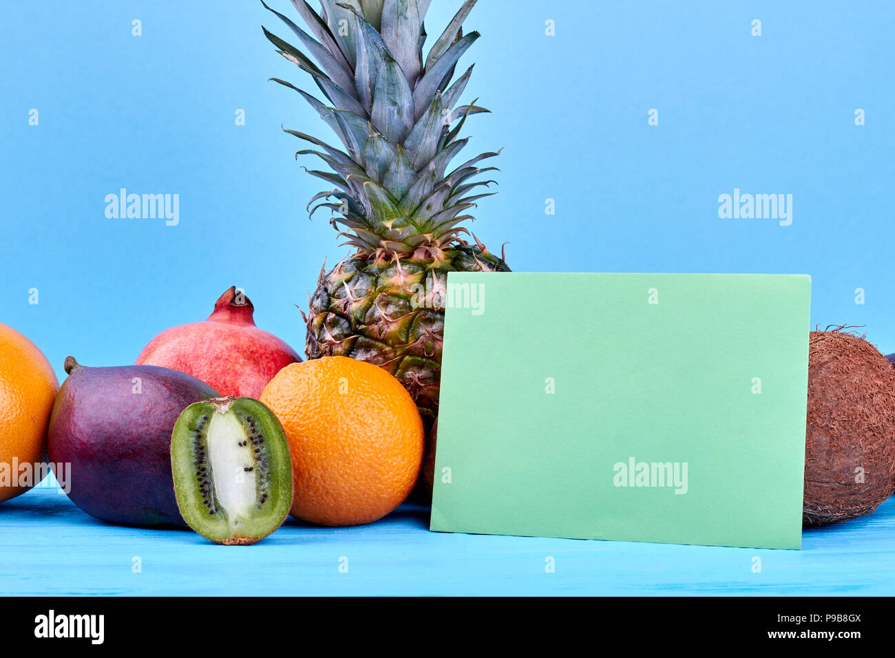 Assortment of tropical fruits and blank paper card. Group of exotic ...