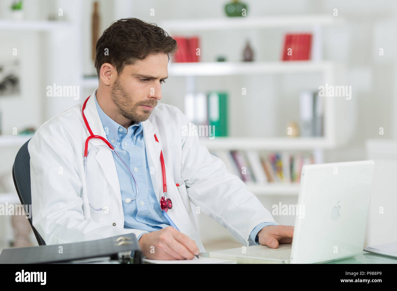 confident doctor at his office at clinic Stock Photo - Alamy