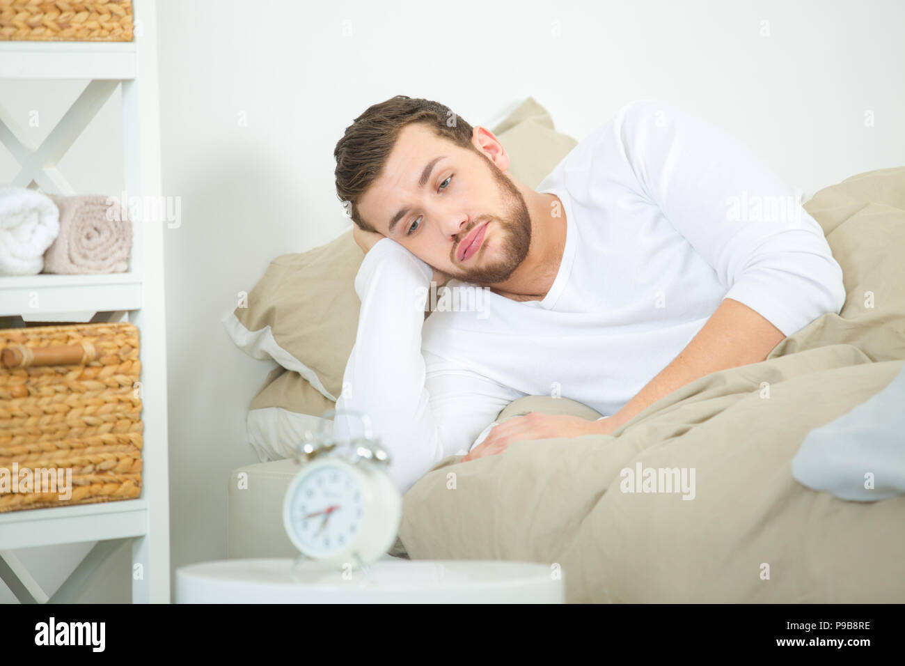 man having trouble waking up in the morning Stock Photo - Alamy