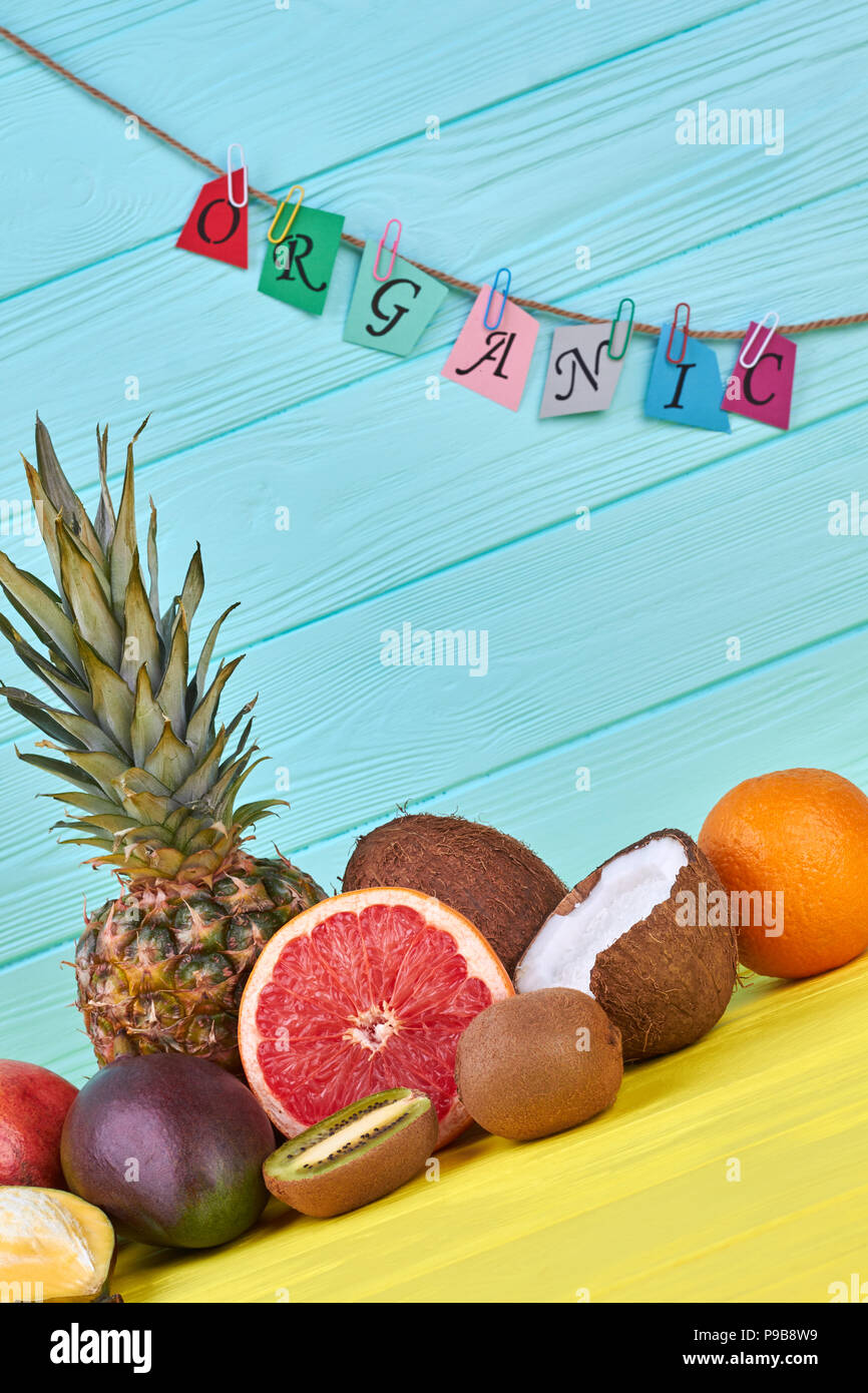 Abundance of fresh fruit on color background. Variety of ripe tropical ...