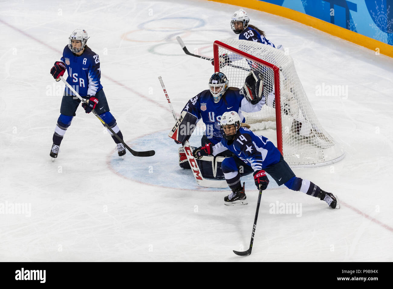 Kacey Bellamy (USA), #22, Maddie Rooney USA goalie and Brianna Decker ...