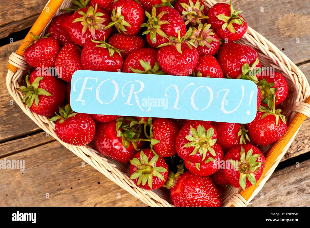 Basket filled with fresh garden strawberries. Ripe juicy strawberries ...