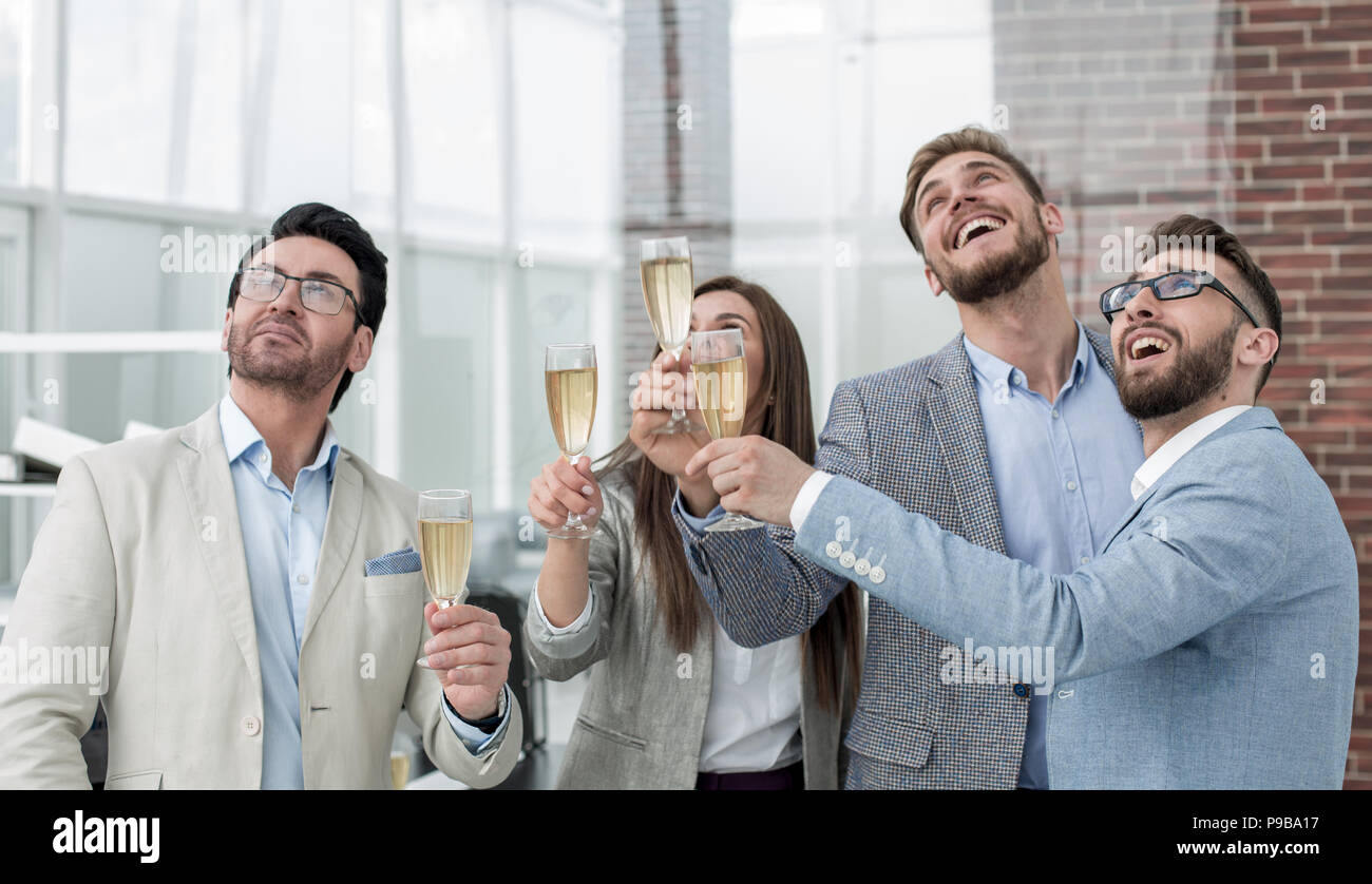 successful business team raising glasses in the new building Stock ...