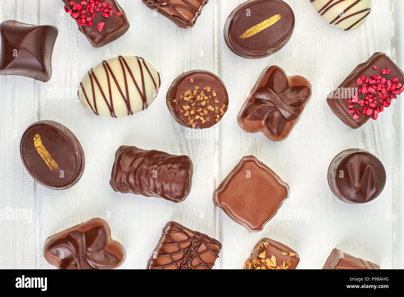 Confectionery sweet background. Variety of chocolate sweets on white ...