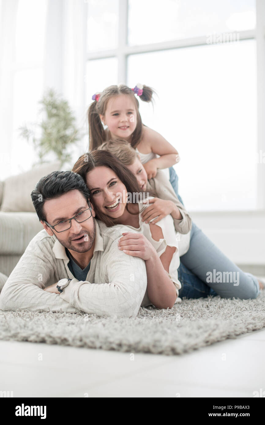 cheerful family relaxes in the living room Stock Photo - Alamy