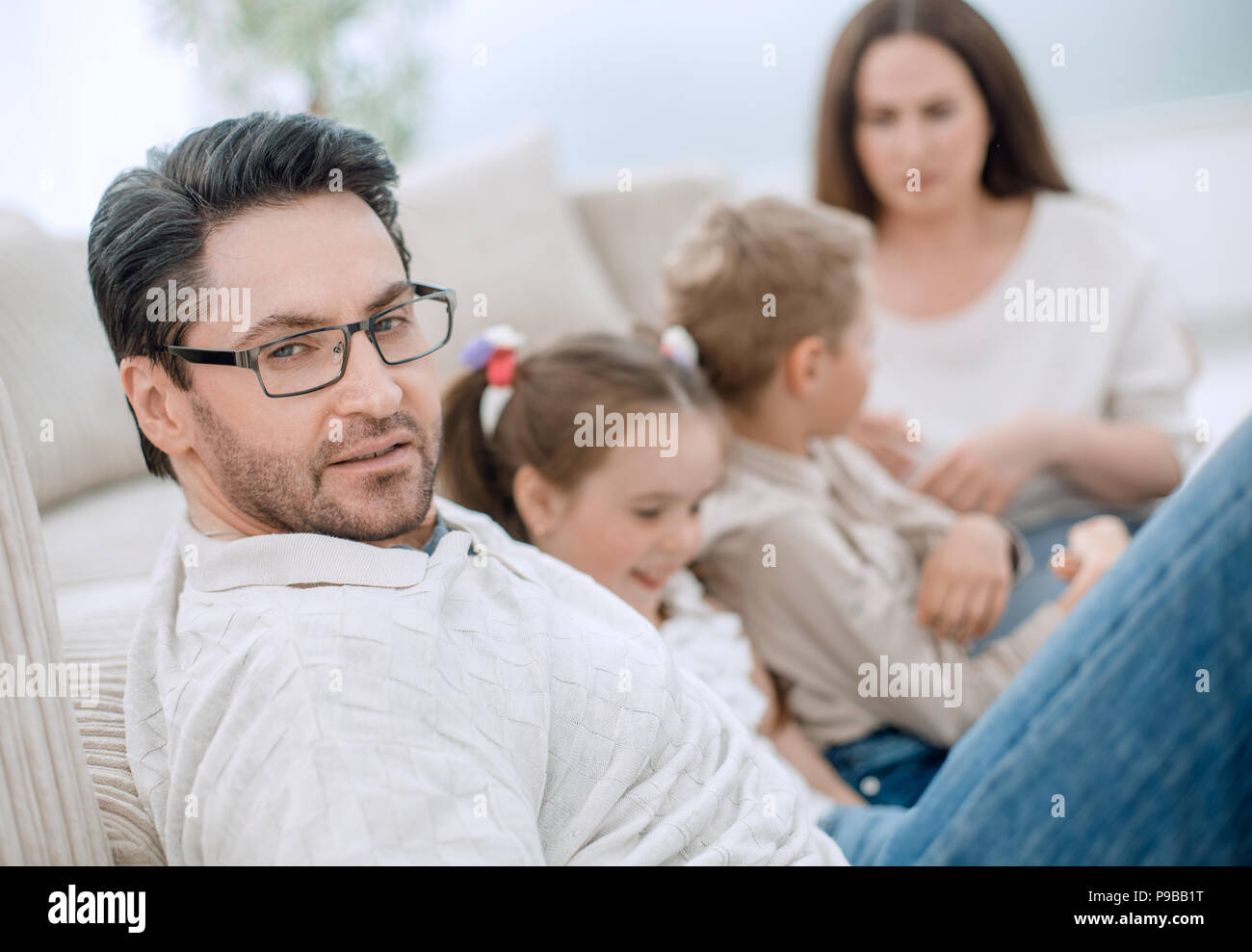 close up.parents play with their children sitting on the couch Stock ...