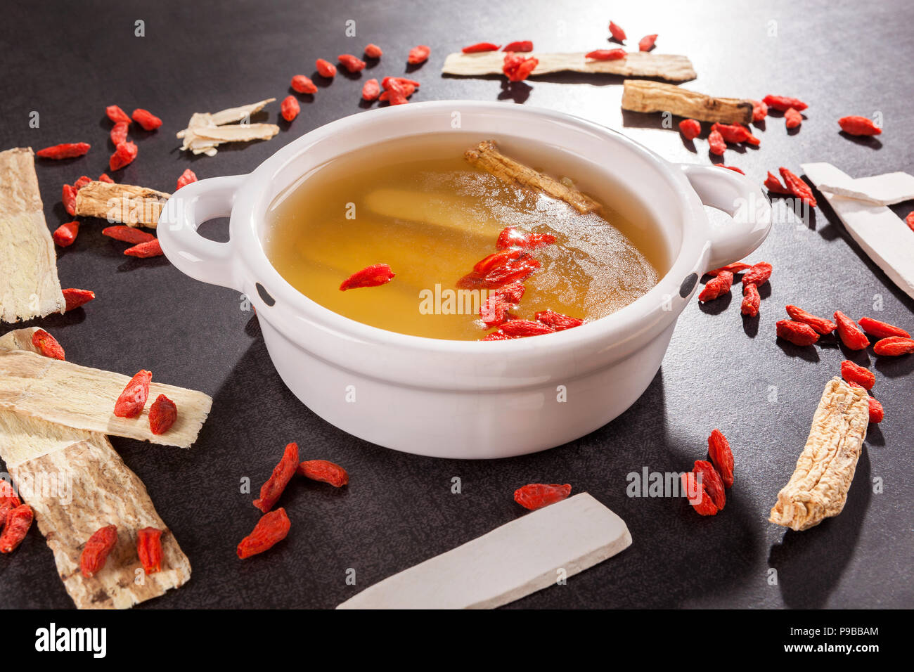 Different kind of Chinese herbal medicine for clear soup on black ...